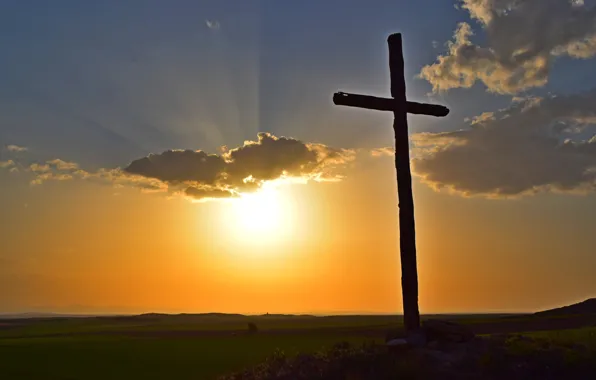 Cross With Sun In Background